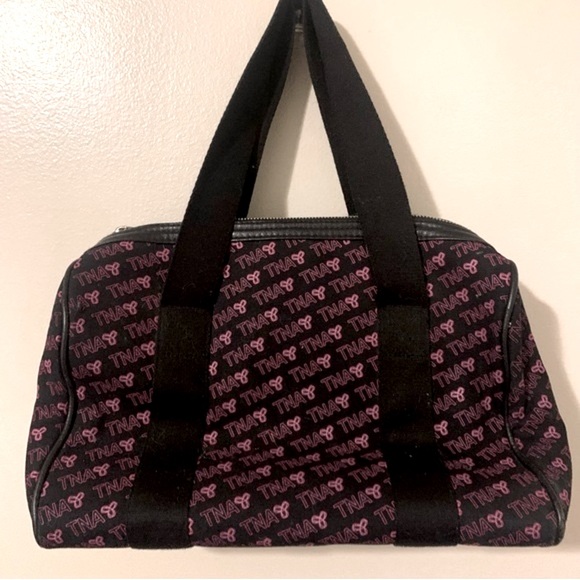 TNA | Bags | Aritzia Tna Small Duffle Black With Pink Tna Logo Satchel ...